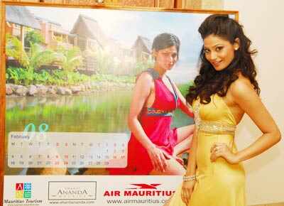 Nova posing in front of her own photograph in the calendar at Shoot ...