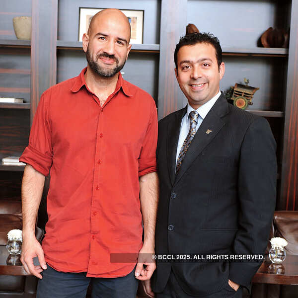 Sunny Hundal and Abhijit Chitnis pose during a cocktail dinner party ...