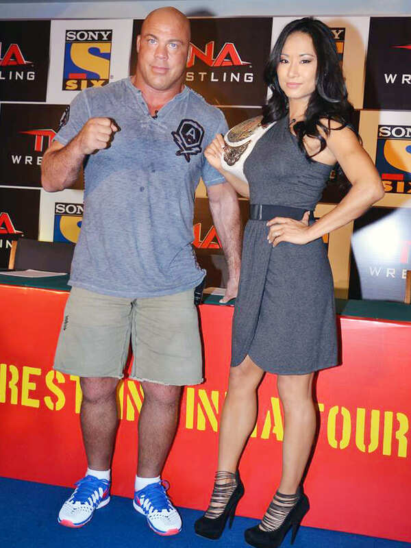 Olympic gold medalist Kurt Angle with woman wrestler Gail Kim during a ...