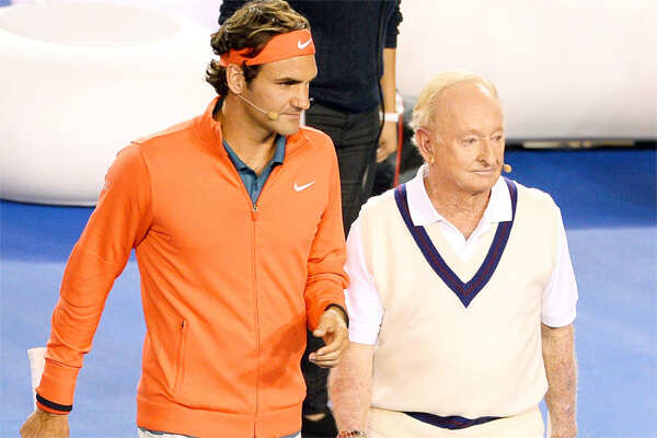 Roger Federer and Rod Laver trade shots