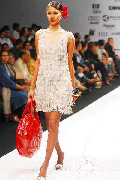 Nethra Raghuraman displays an outfit from designer Ritu Kumar's fall ...