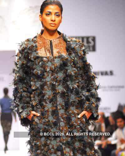Models display an outfit from designer Varun Bahl's fall/winter collection being showcased on ...