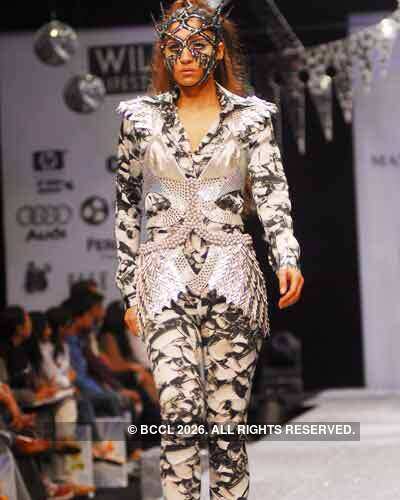 Michelle Innes displays an outfit from designer Manish Arora's fall ...