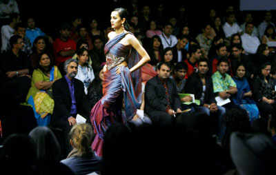 Poonam Nath displays an outfit from designers Ashima and Leena's fall ...