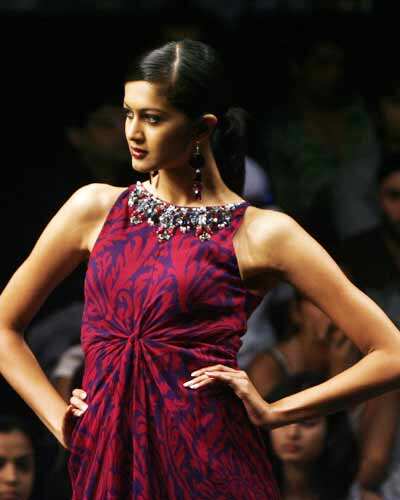 Poonam Nath displays an outfit from designers Ashima and Leena's fall ...