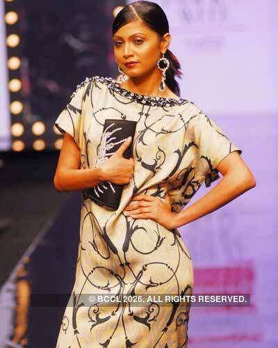 Poonam Nath displays an outfit from designers Ashima and Leena's fall ...