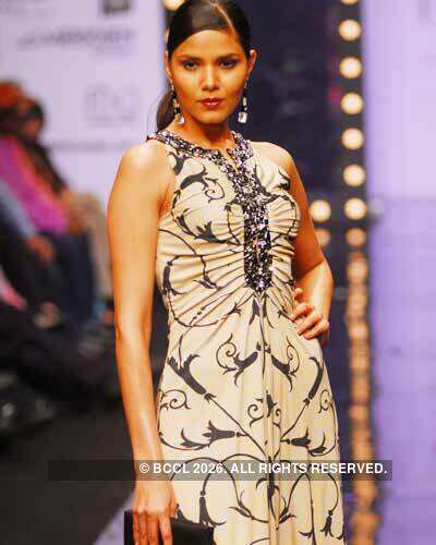 Poonam Nath displays an outfit from designers Ashima and Leena's fall ...