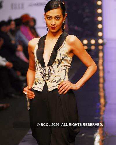 Poonam Nath displays an outfit from designers Ashima and Leena's fall ...