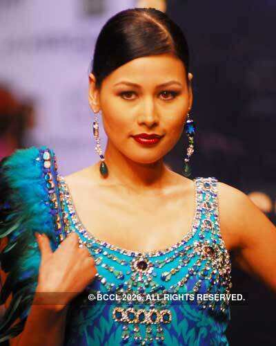 Poonam Nath displays an outfit from designers Ashima and Leena's fall ...