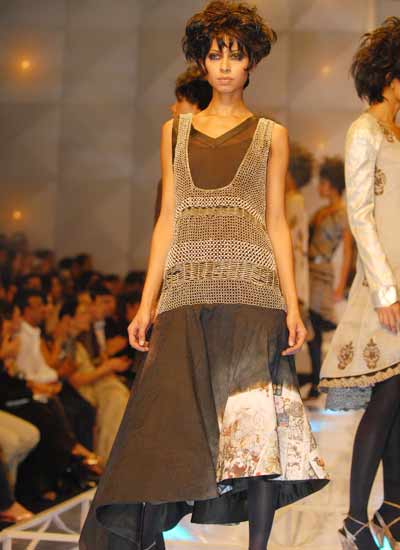 Models display outfits from designers Anamika Khanna and Ashish Soni's ...