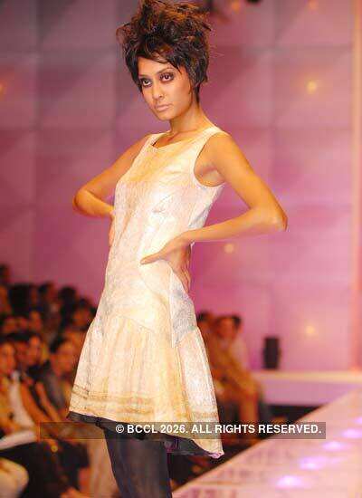 Pia Trivedi displays an outfit from designers Anamika Khanna and Ashish ...