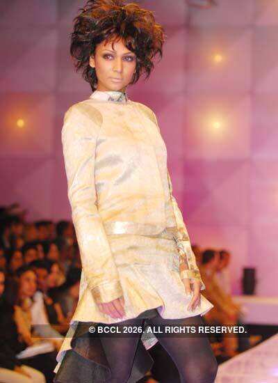 Pia Trivedi displays an outfit from designers Anamika Khanna and Ashish ...