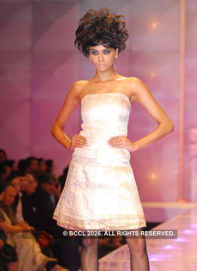 Pia Trivedi displays an outfit from designers Anamika Khanna and Ashish ...