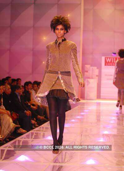 Pia Trivedi displays an outfit from designers Anamika Khanna and Ashish ...