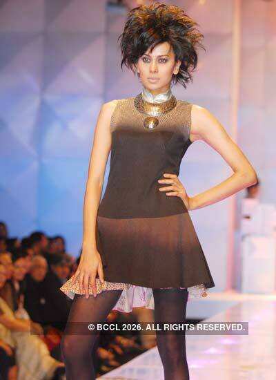 Pia Trivedi displays an outfit from designers Anamika Khanna and Ashish ...