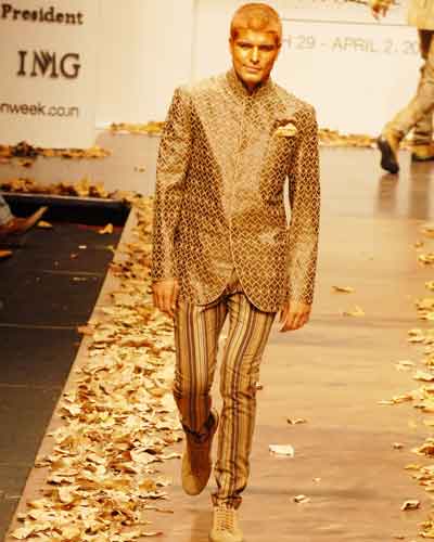 A model displays an outfit from Arjun Khanna's autumn/winter collection ...
