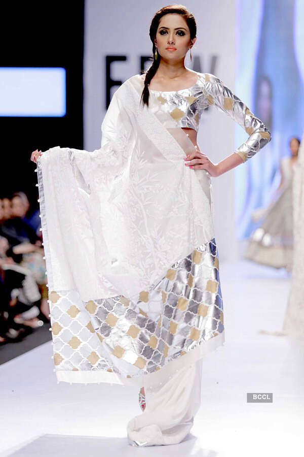 A Pakistani model presents a creation by designer Nida Azwer during the ...