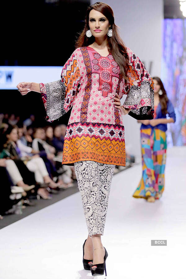 A Pakistani model presents a creation by HSY during the day one of ...