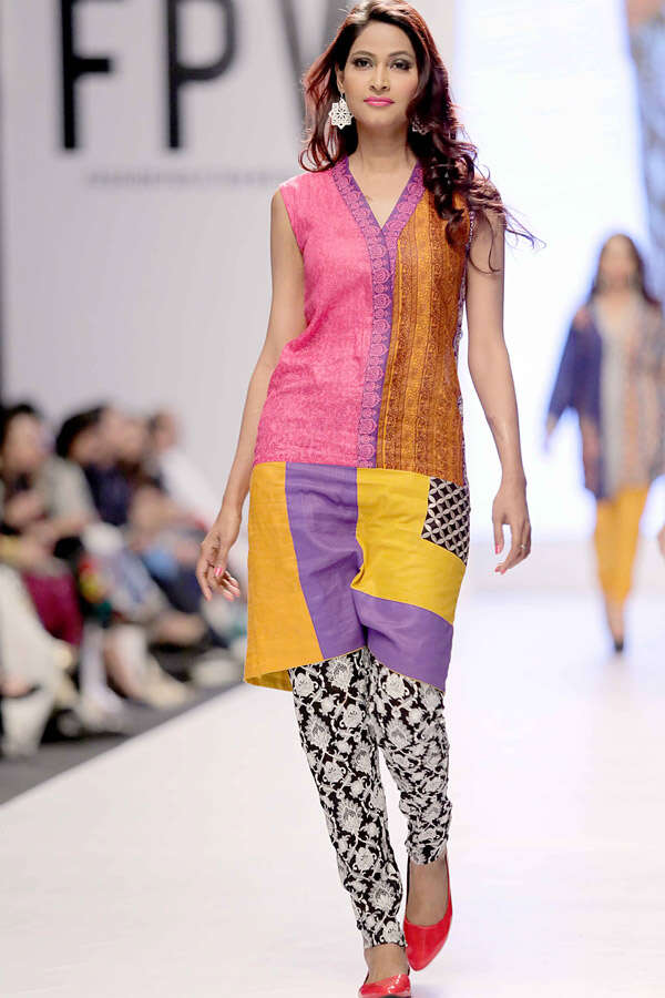 A Pakistani model presents a creation by HSY during the day one of ...