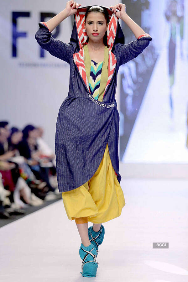 A Pakistani model presents a creation by HSY during the day one of ...