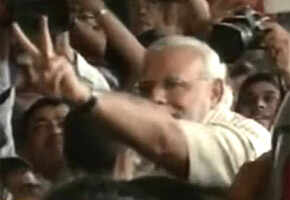Narendra Modi flaunts victory sign
