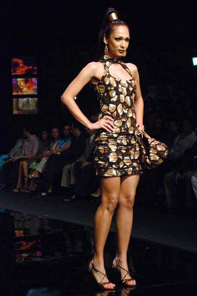 A model wears a creation by designer Malini Ramani at Chivas Regal ...