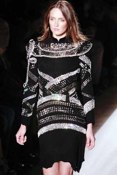 A model flaunts a creation by the French fashion designer Christophe ...