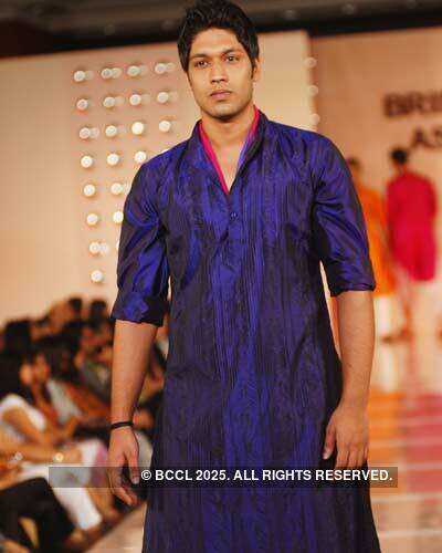 Designer Raghavendra Rathore poses with models after presenting his ...