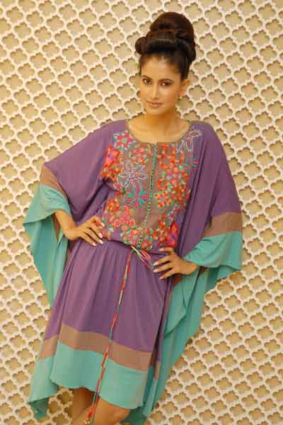 A model showcases a creation from Designer Ranna Gill's collection ...