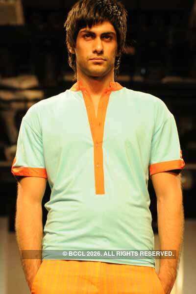 Joey Mathews displays a creation by designer Siddharth Tytler during ...