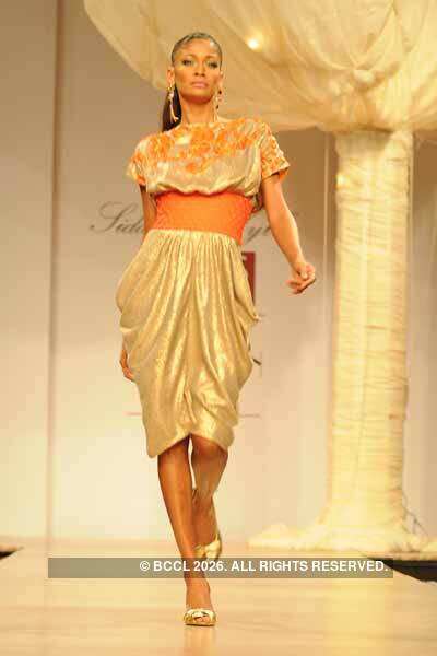 Joey Mathews displays a creation by designer Siddharth Tytler during ...