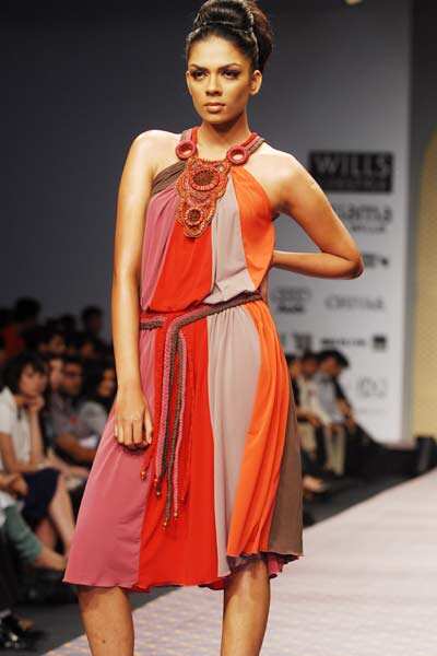 Gauhar Khan displays a creation by designer Ranna Gill during the Wills ...