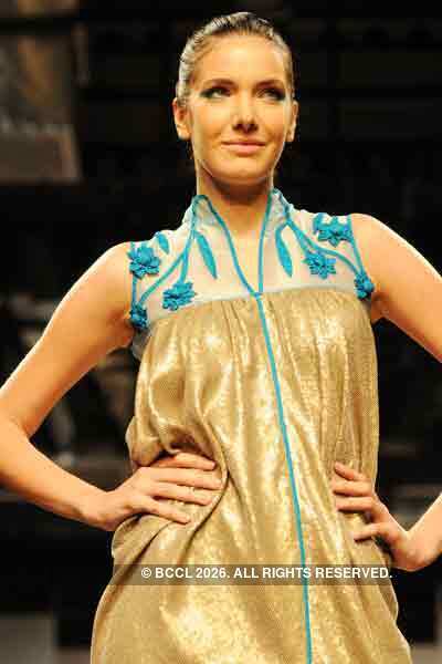 Joey Mathews displays a creation by designer Siddharth Tytler during ...