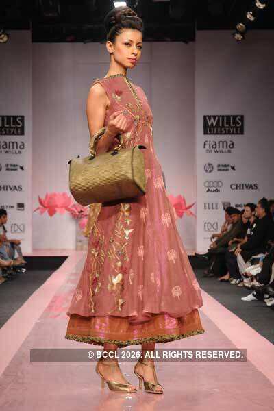 Aline displays a creation by designers Ashish, Viral and Vikrant during ...