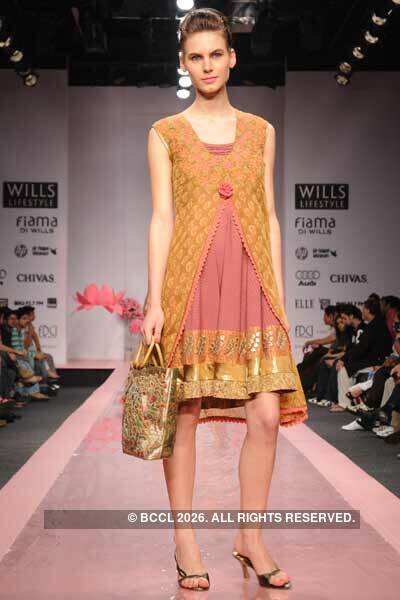 Aline displays a creation by designers Ashish, Viral and Vikrant during ...