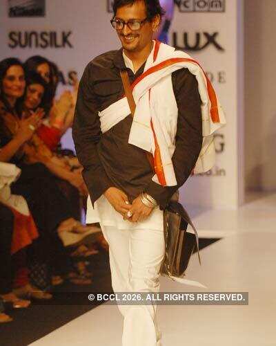 A model presents a creation from designer Anand Kabra's collection ...