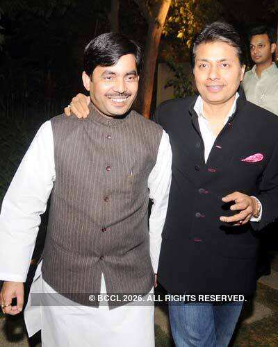 Rohit Rajpal (R) with a friend at Seema and Sandeep Jajodia's annual ...