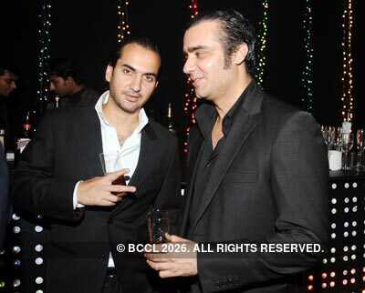 Rohit Rajpal (R) with a friend at Seema and Sandeep Jajodia's annual ...