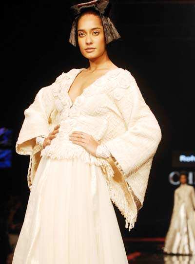 Lisa Haydon presents a creation by designer Rohit Bal during a fashion ...