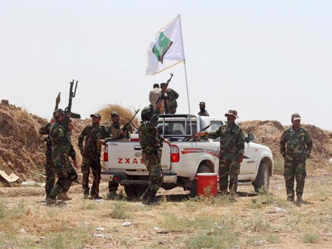 Iraqi forces break militant siege of Shiite town
