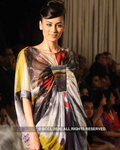 Sonalika Sahay displays a creation by designer Amit Agarwal during a ...