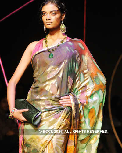 Michelle Innes presents a creation by designer Satya Paul during Day 1 ...