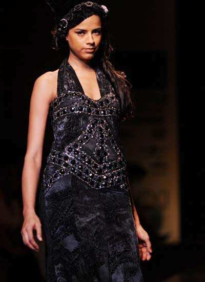 Bhawna presents a creation by designer Reynu Taandon during Day 4 of ...