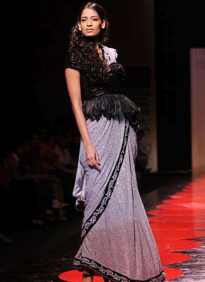 Bhawna presents a creation by designer Reynu Taandon during Day 4 of ...