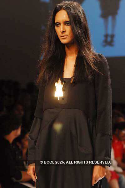 Designer Kallol Datta (C) on the ramp with models after presenting his ...