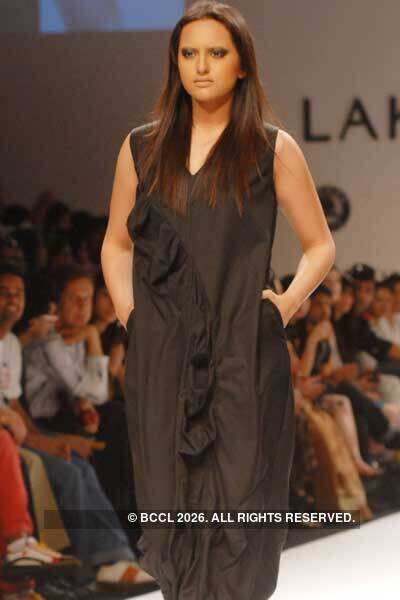 Designer Kallol Datta (C) on the ramp with models after presenting his ...