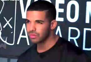 Drake throws thousands of dollars on the ground