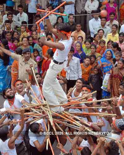 Hundreds of devotees pull the chariots of Lord Balram in a procession ...