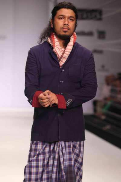 A model displays a creation by designer Rajesh Pratap Singh during the ...