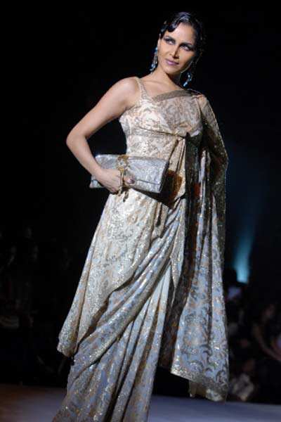 Nethra Raghuraman showcases a creation by designer Suneet Varma during ...